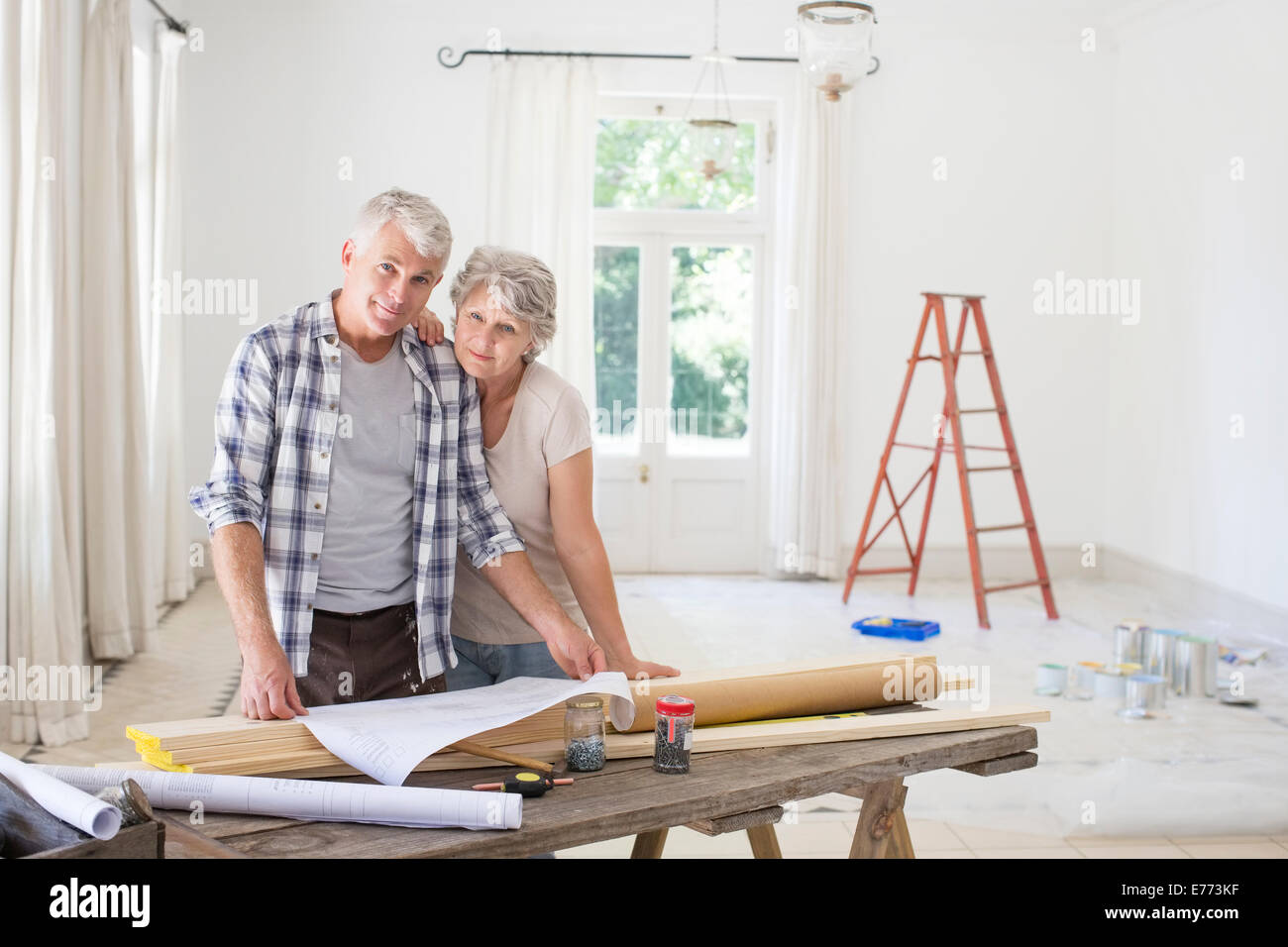 Older couple looking through documents together Stock Photo - Alamy