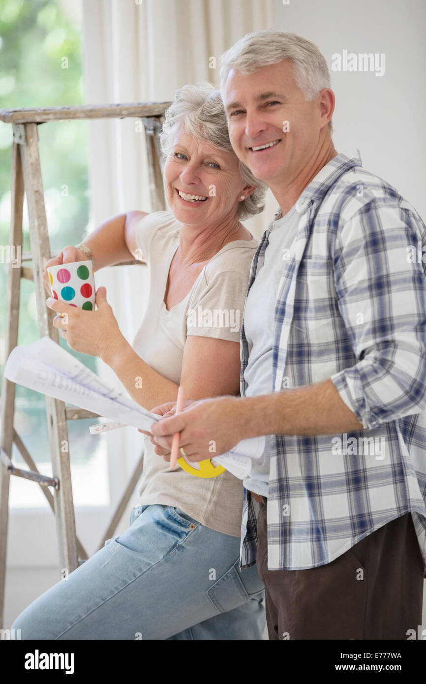 Older couple looking through documents together Stock Photo - Alamy