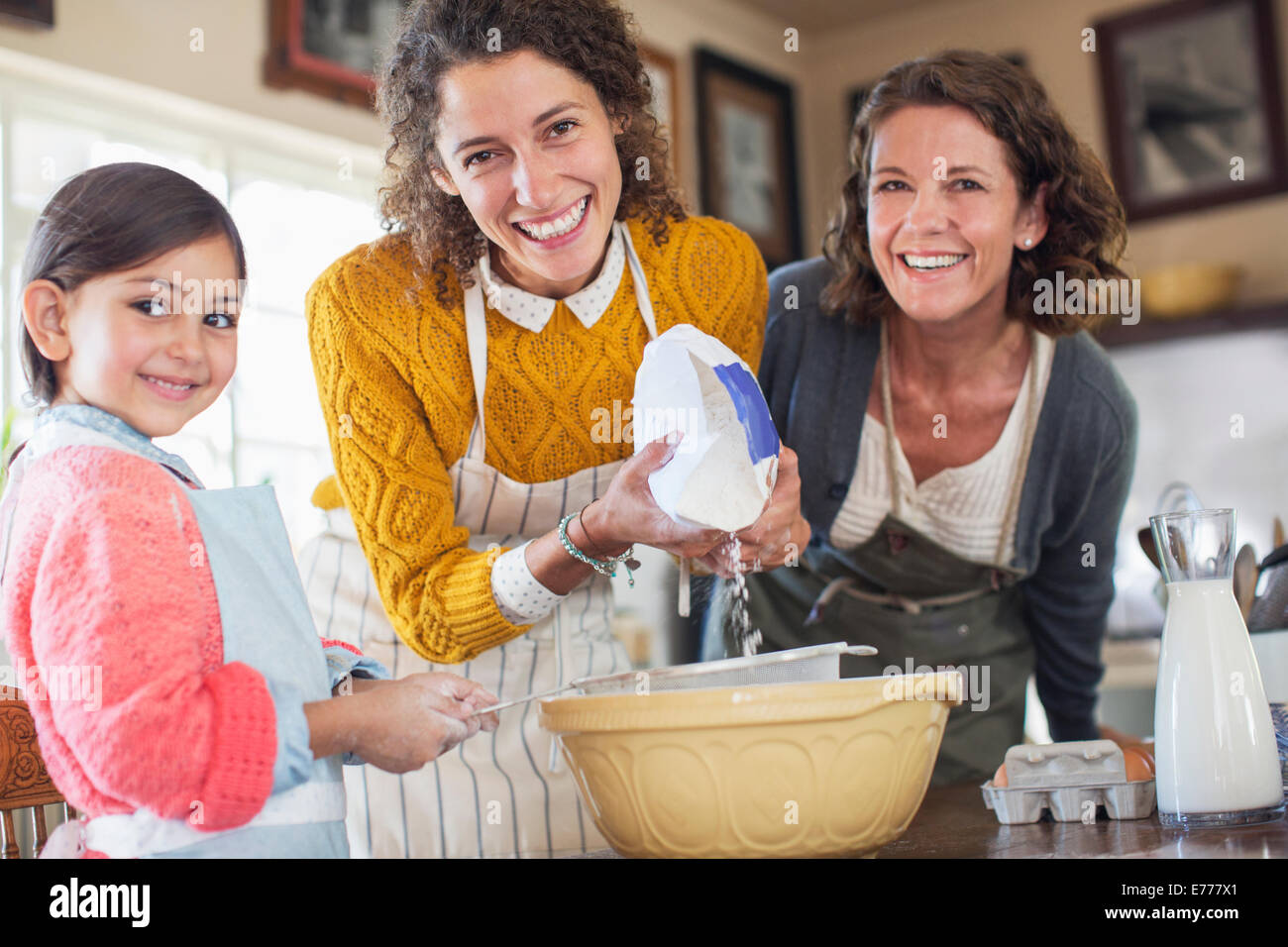 Three generations of women baking together Stock Photo - Alamy