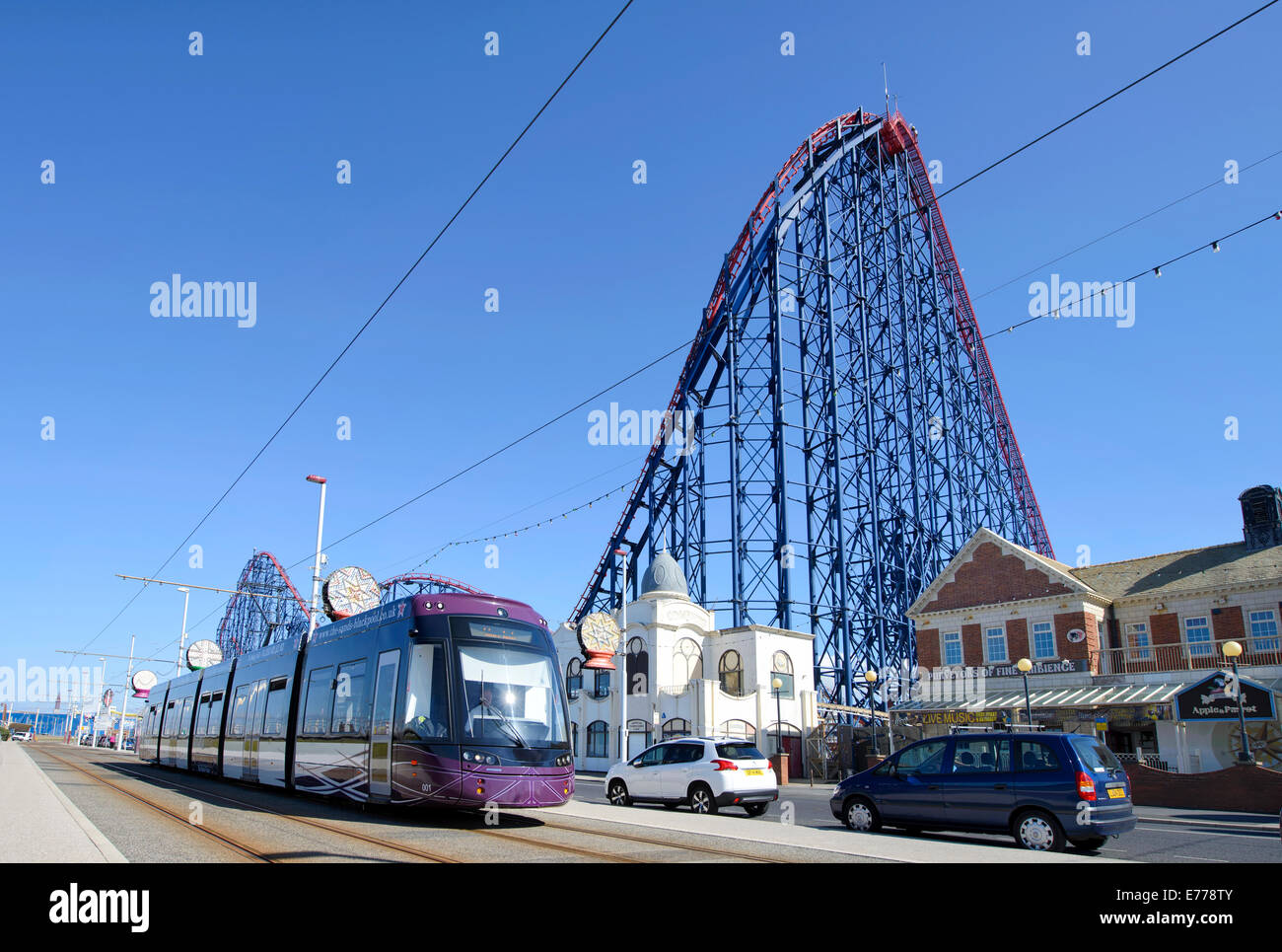 A tram passes in front of The Big One roller coaster in Blackpool ...