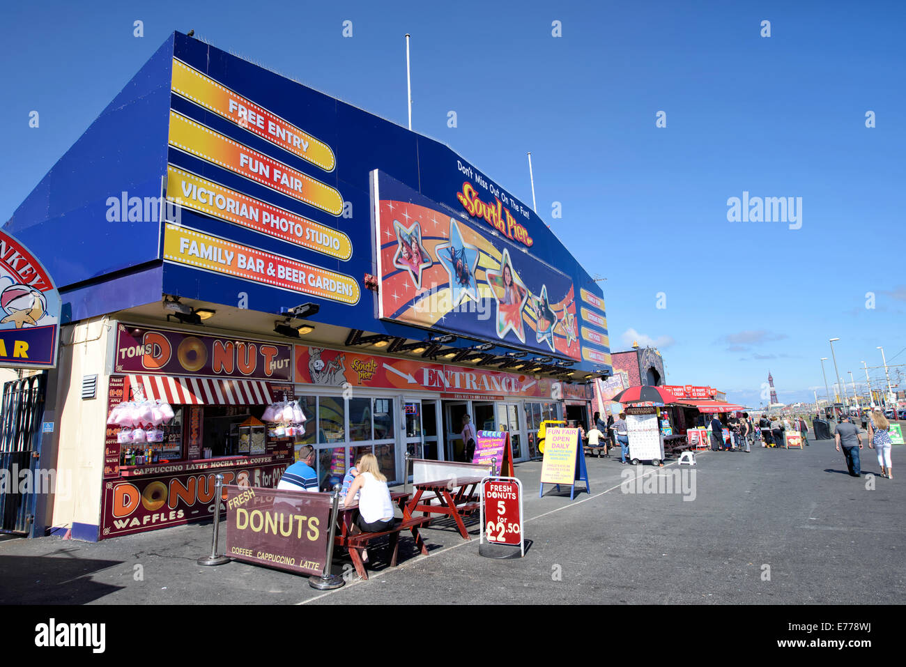 The entrance to South Pier in Blackpool. There are three fully ...