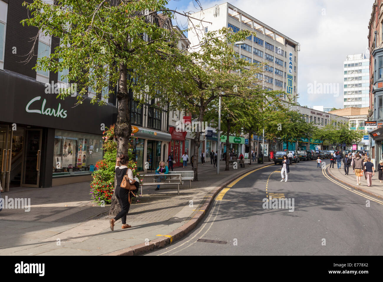 People and shops on a Nottingham street in the city centre. Wheeler ...