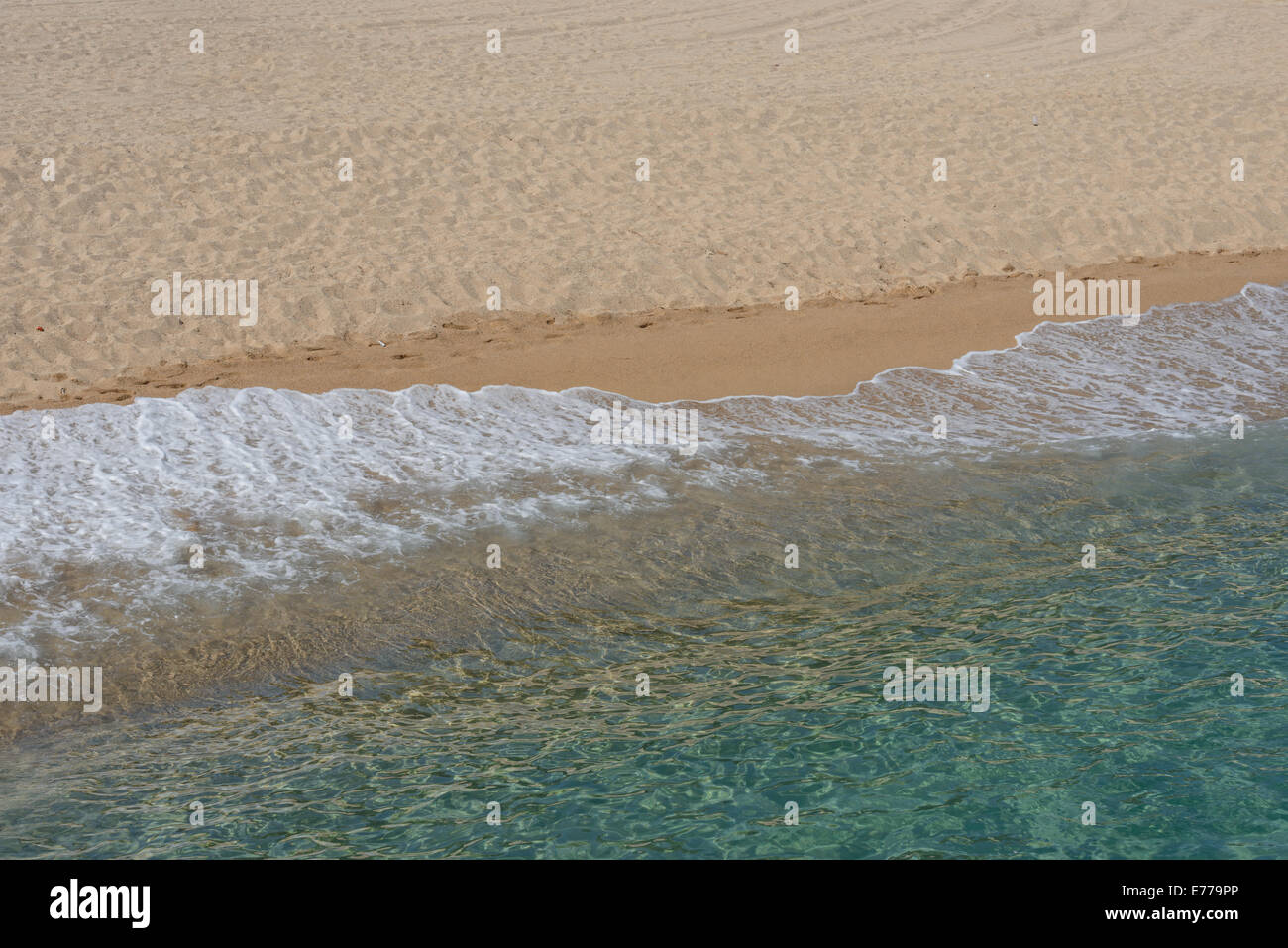 Calm wave of sea swash on the sand of beach Stock Photo - Alamy