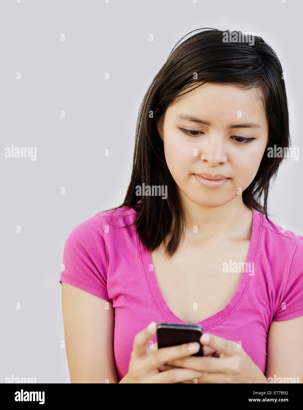 Young Asian woman texting Stock Photo - Alamy