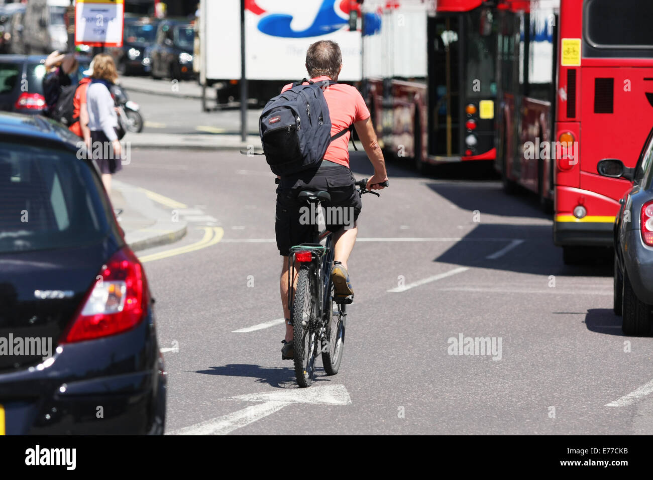 Male cyclist car behind on hi-res stock photography and images - Alamy