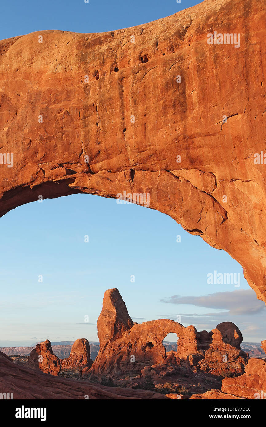 Turret Arch seen through the North Window Arch at sunrise in Arches ...
