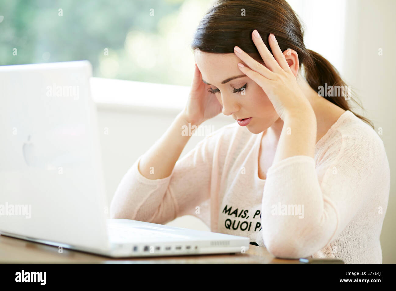 Tired girl working from home Stock Photo - Alamy