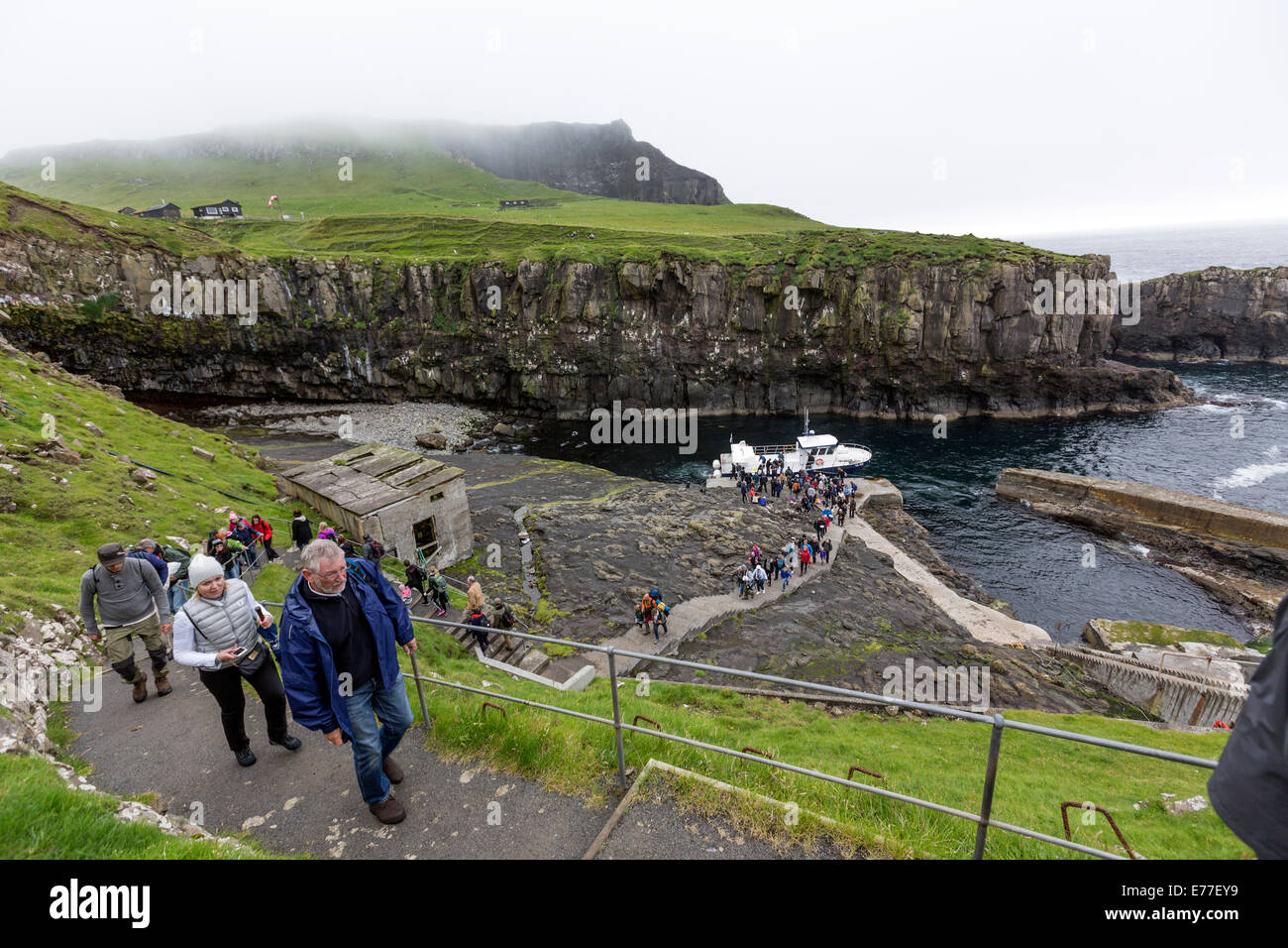 Passengers arriving the Mykines harbor after leaving the ferry from ...