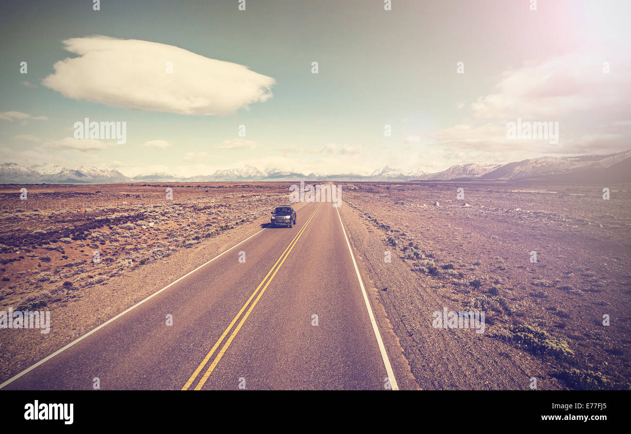Vintage picture of car on endless country highway, Ruta 40 in Argentina ...