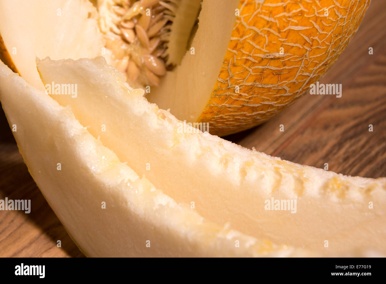 yellow netted melon - the fruit and slices Stock Photo - Alamy
