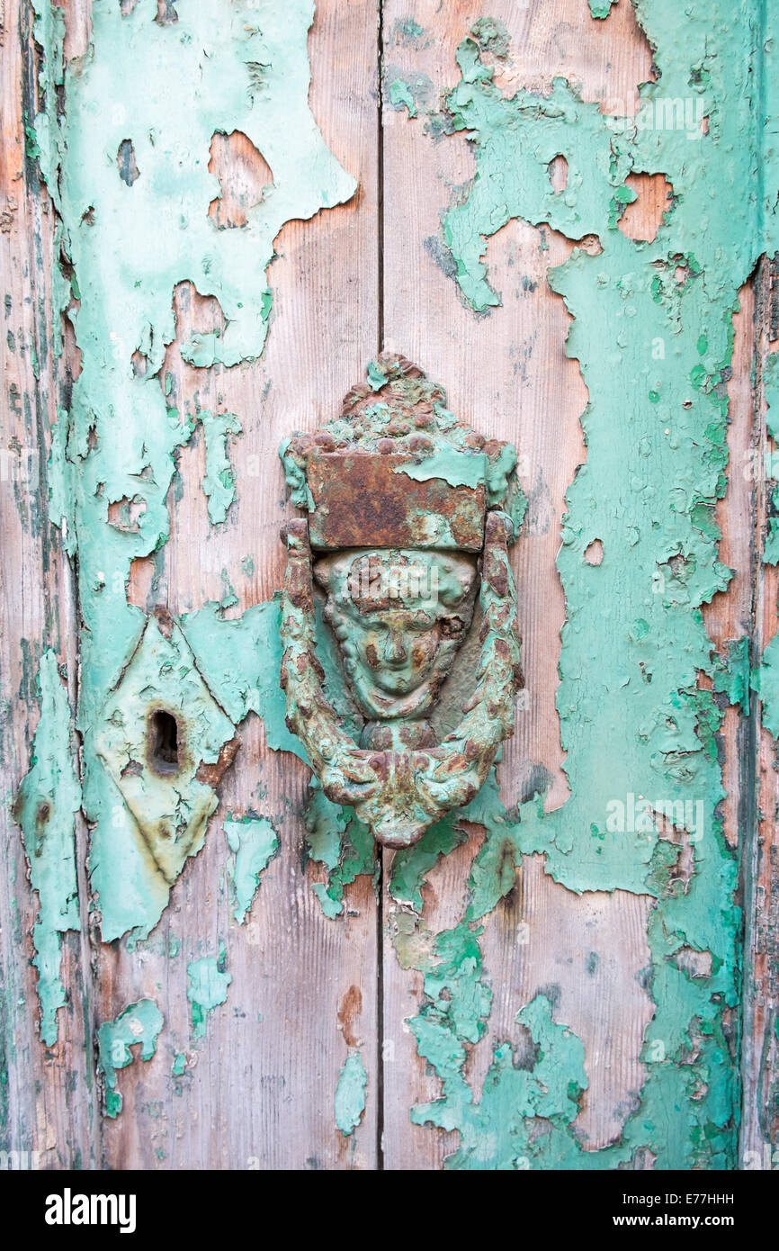 Rustic old rusty door knocker and key hole Stock Photo - Alamy