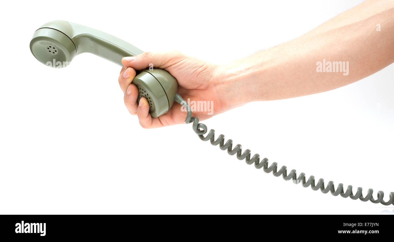 Hand holding out an old telephone's handset Stock Photo - Alamy