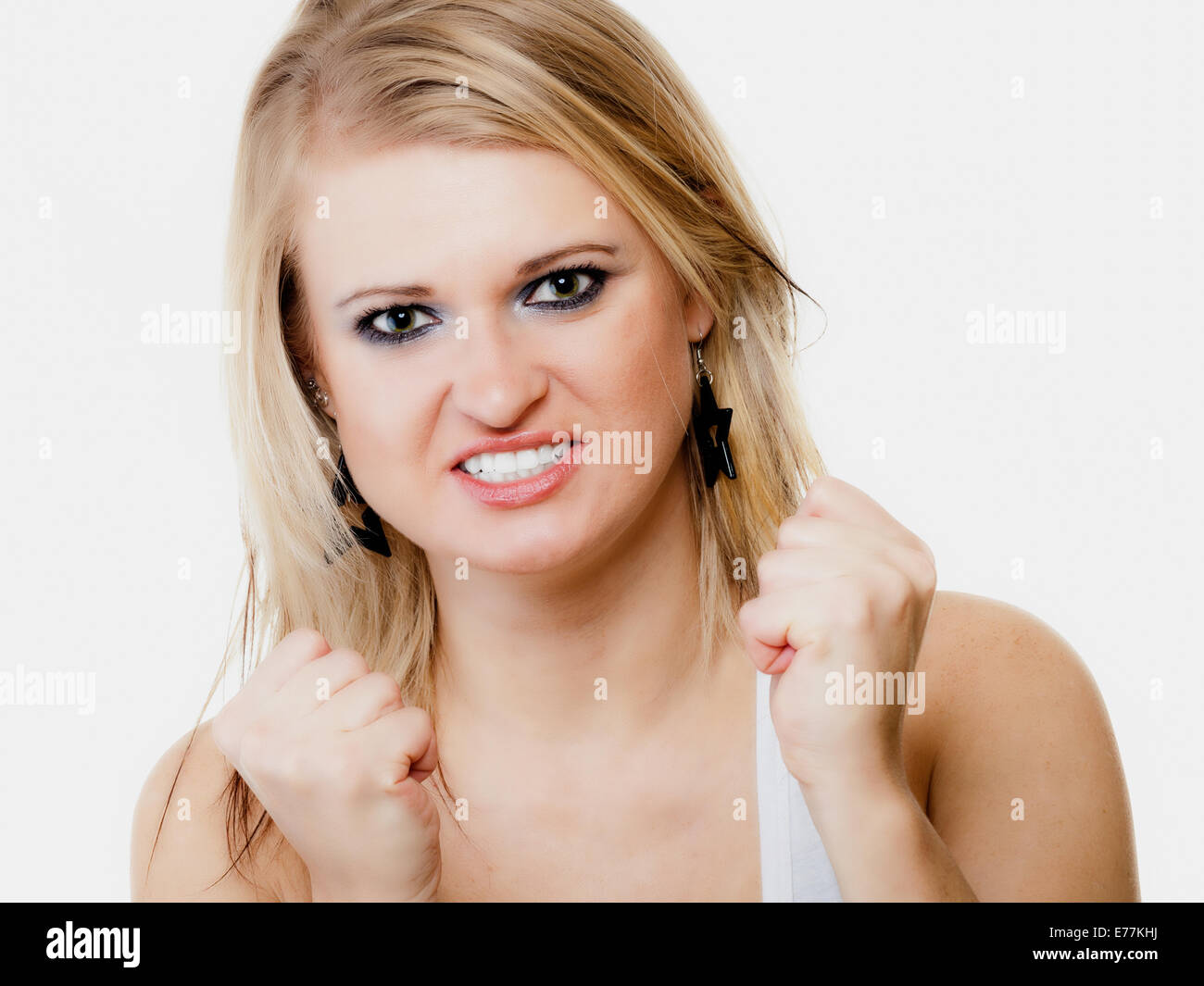 Body language. Portrait of blonde girl winner celebrating success hand ...
