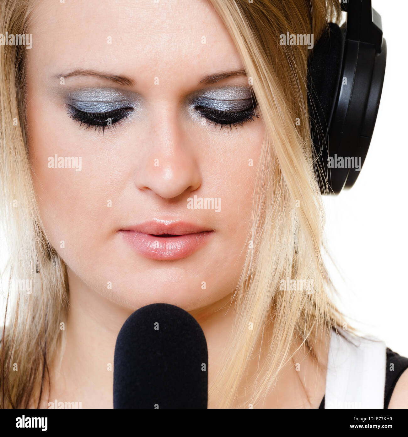 emotional blonde girl singer performer musician singing a song to ...