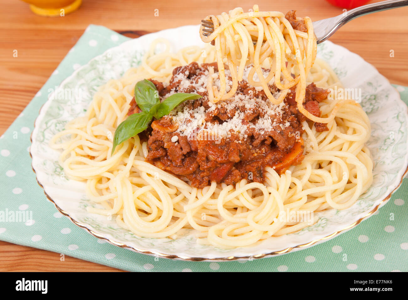 spaghetti bolognese served in the plate on wooden table Stock Photo - Alamy