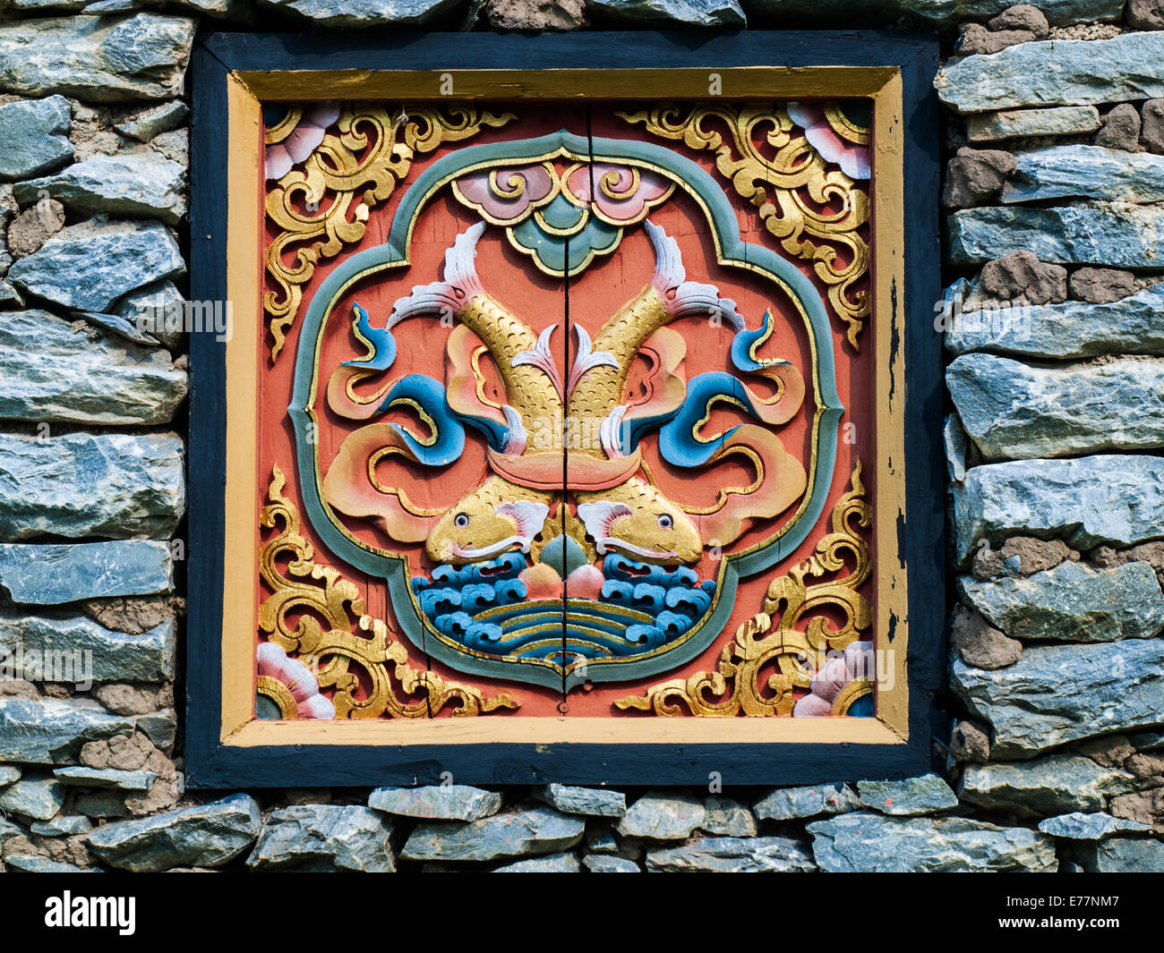 Bhutan traditional wooden decoration in rock wall Stock Photo - Alamy