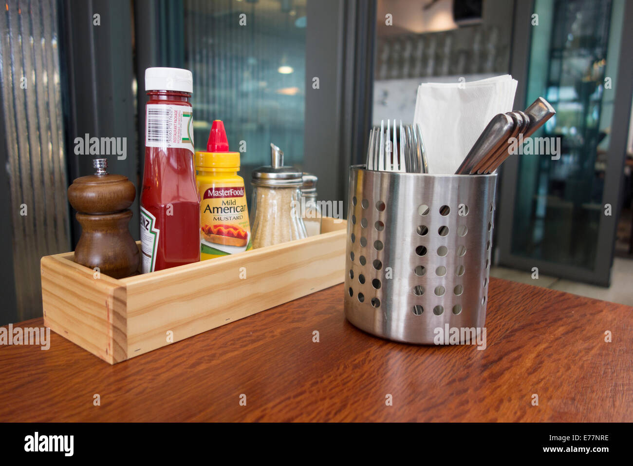 Table with condiments and utensils Stock Photo - Alamy