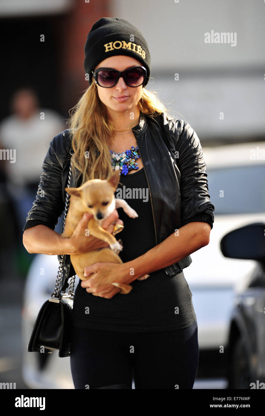 Paris Hilton and her toy pet dog Chihuahua 'Peter Pan' arriving at ...