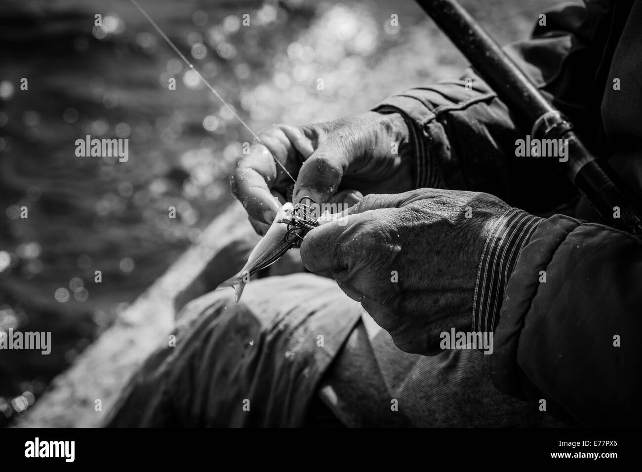 Man rod fishing in Black and White Stock Photos & Images - Alamy