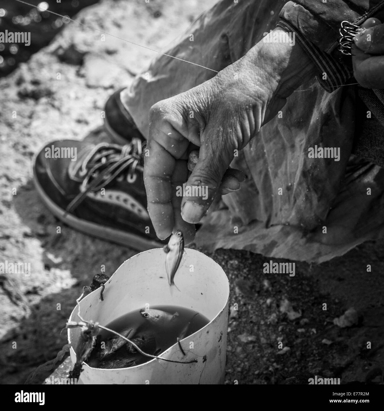 Man rod fishing in Black and White Stock Photos & Images - Alamy