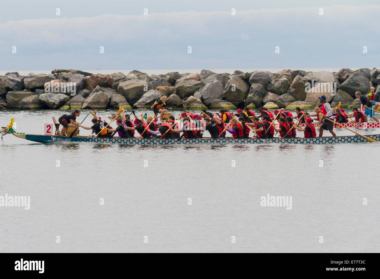 Two dragon boat racing teams race to the finish at the Dragon Boat ...