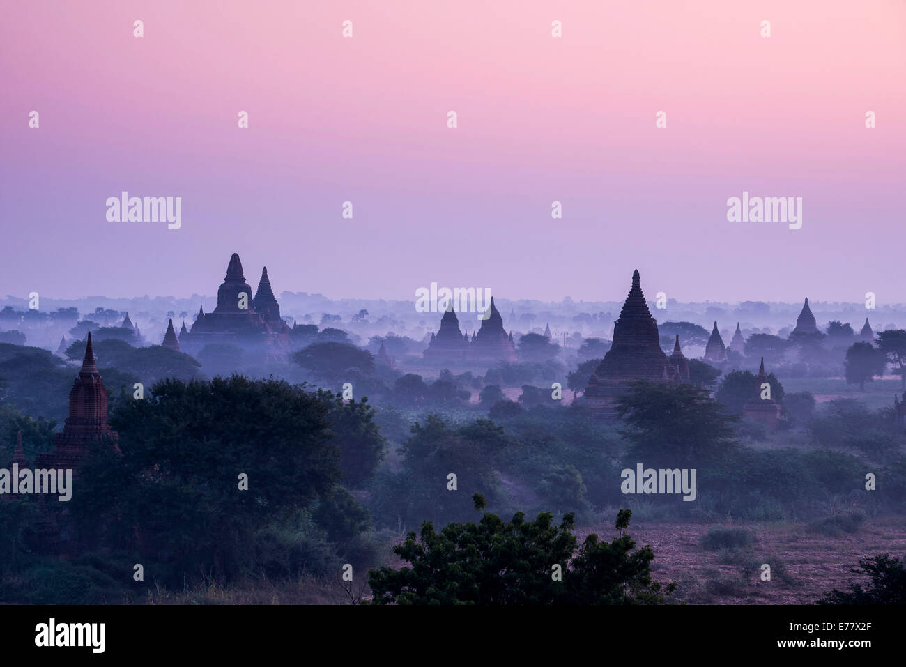 Sunrise, temples in the morning mist, stupas and pagodas in the temple ...
