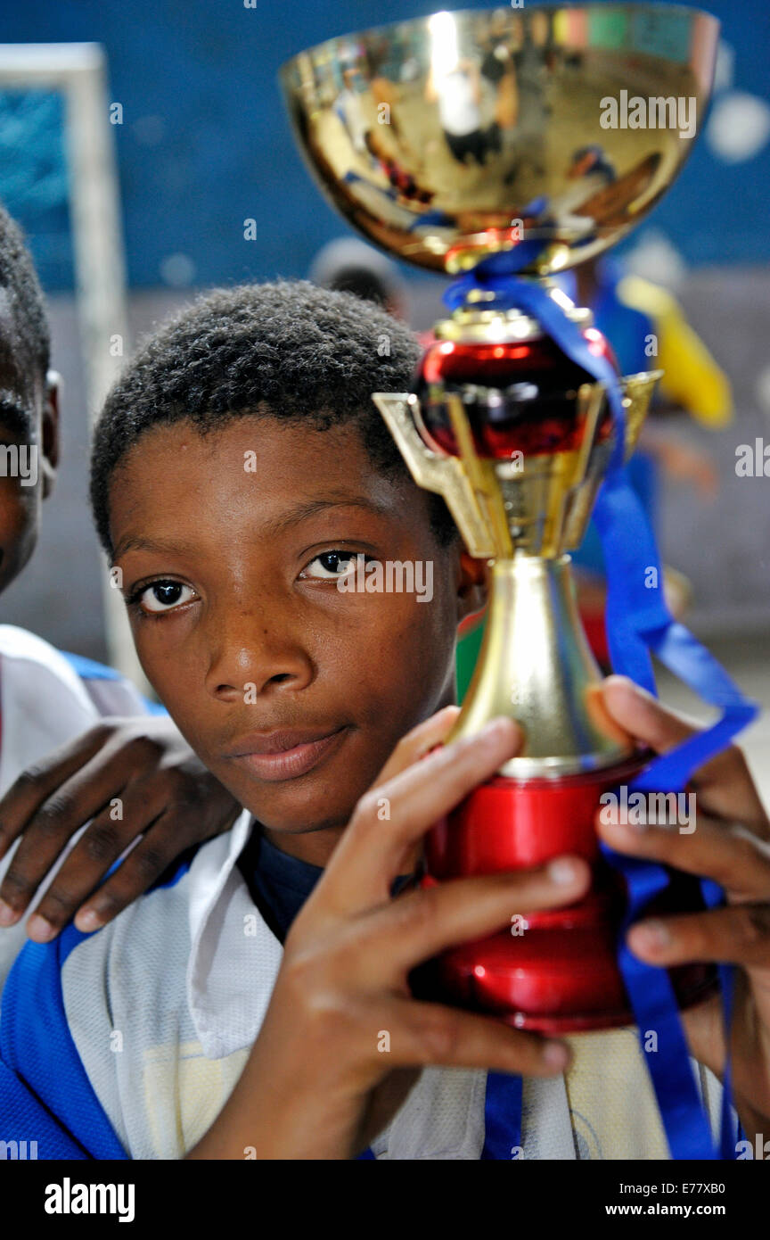 Boy holding trophy soccer tournament hi-res stock photography and ...