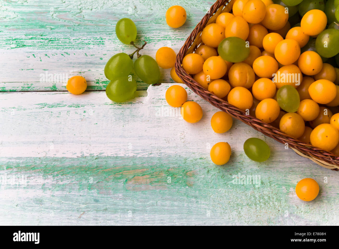 Summer or fall harvest of fruits on wooden background Stock Photo - Alamy