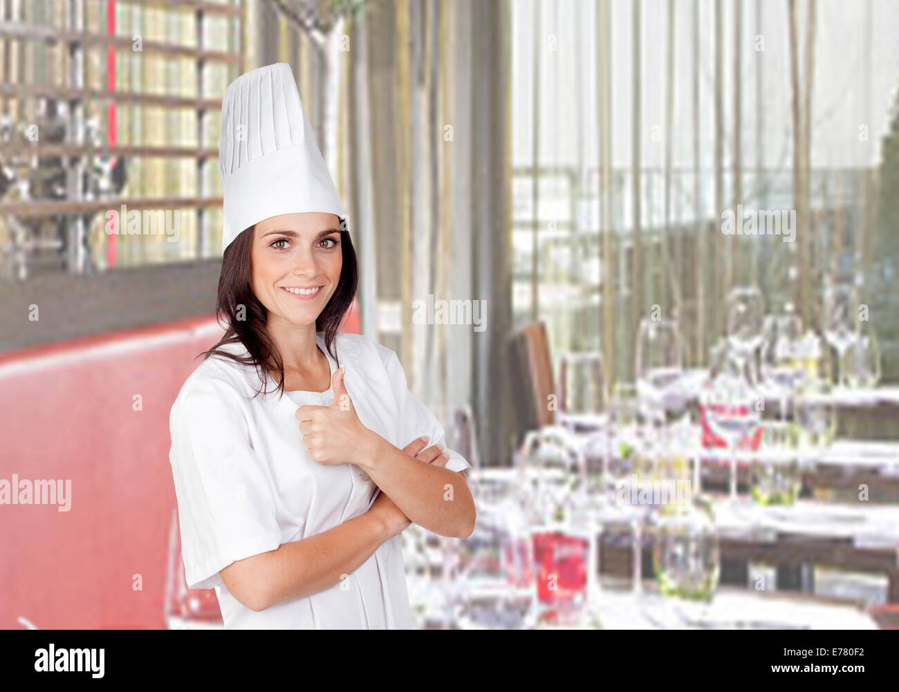 Pretty cook woman saying Ok in her restaurant Stock Photo - Alamy