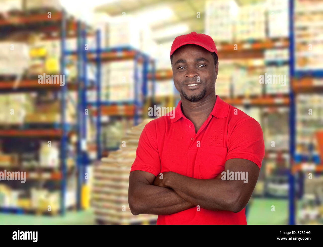 Worker man with red uniform in his workplace Stock Photo - Alamy