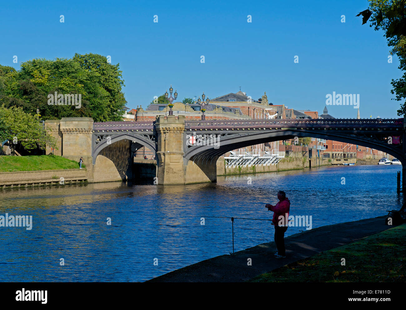 Angler fishing in the River Ouse, near Skeldergate Bridge, York, North ...