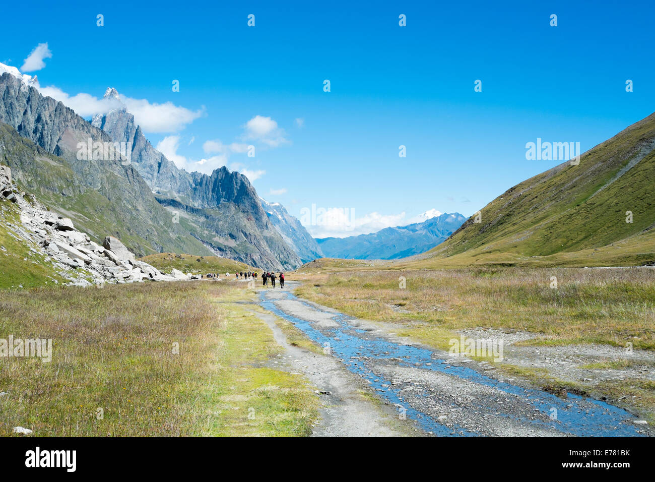 VAL VENY, ITALY - AUGUST 27: Hikers on valley path with Limestone ...
