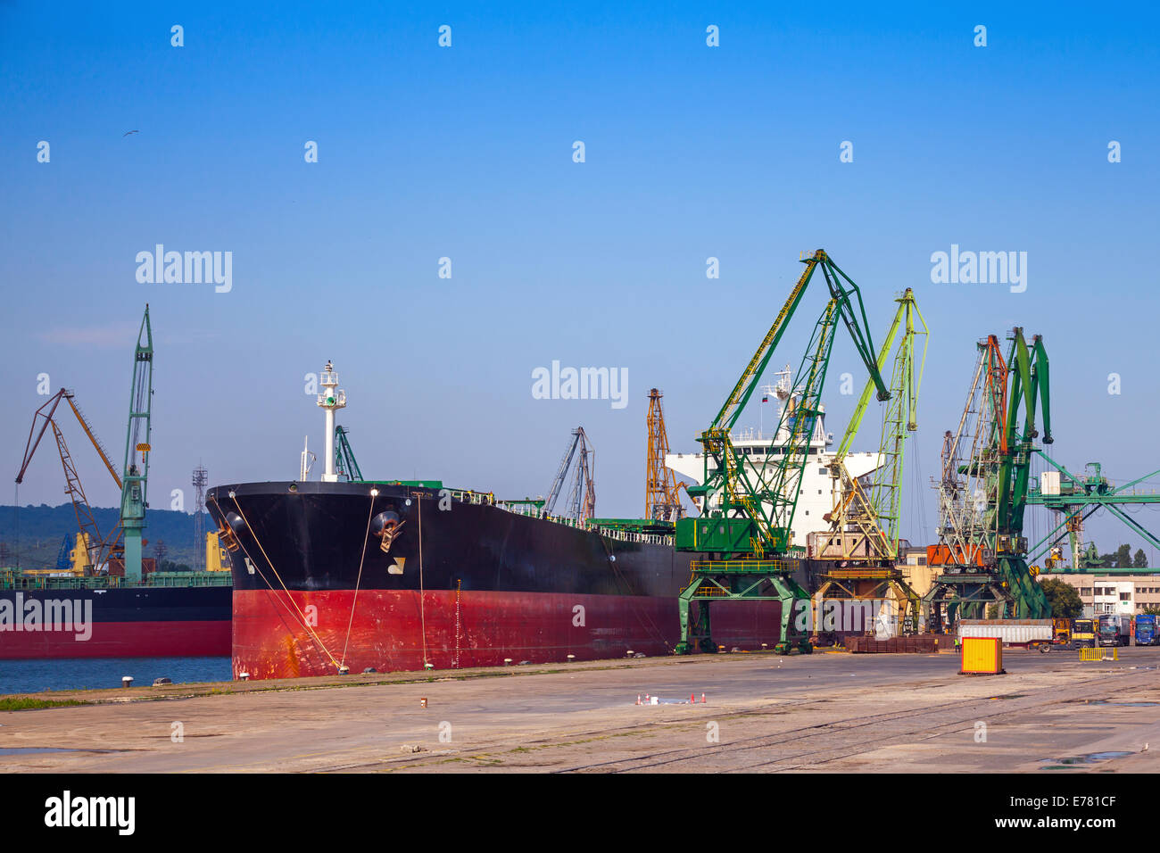 Big industrial cargo ship is loading in port of Varna Stock Photo - Alamy