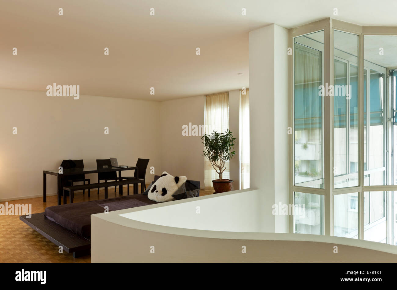 Bright duplex with hardwood floors, wide room with large window Stock ...