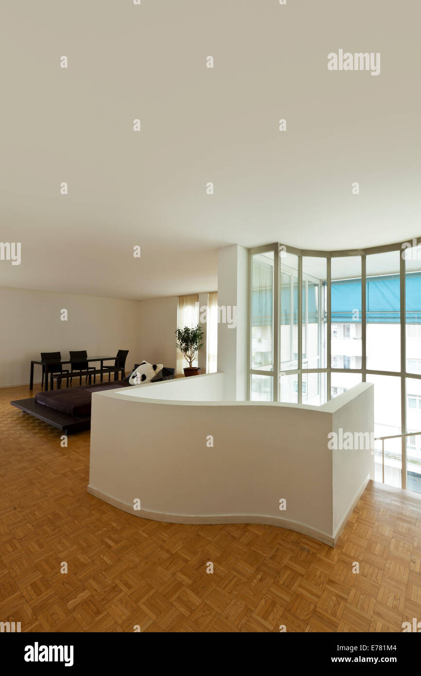 Bright duplex with hardwood floors, wide room with large window Stock ...