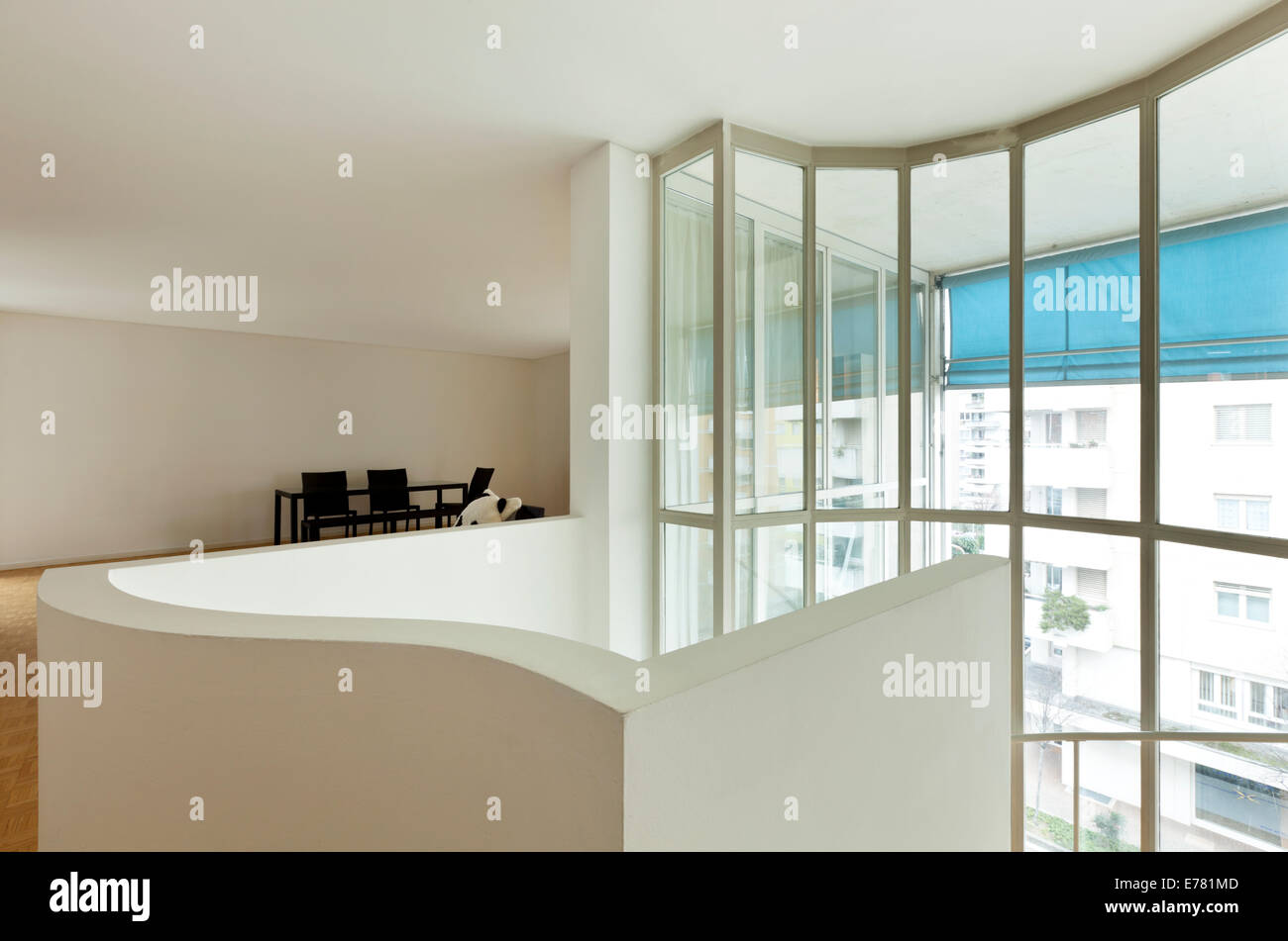 Bright duplex with hardwood floors, wide room with large window Stock ...