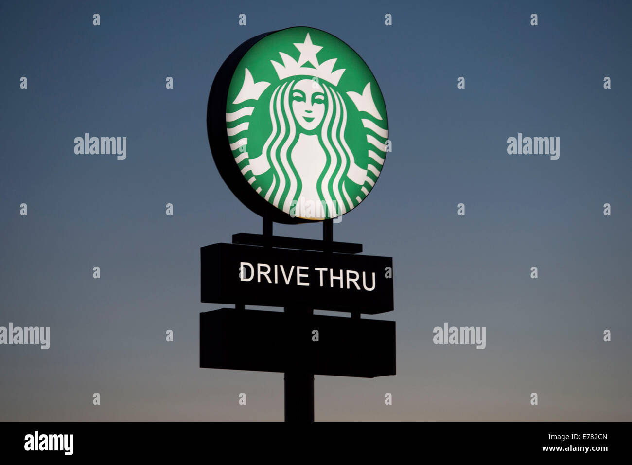 Starbucks coffee drive through sign at sunset Stock Photo - Alamy