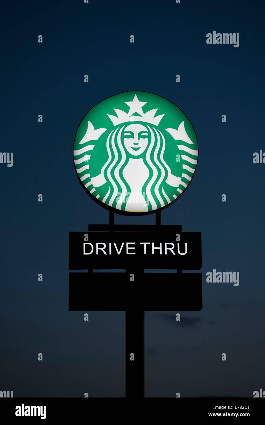 Starbucks coffee drive through sign at sunset Stock Photo - Alamy