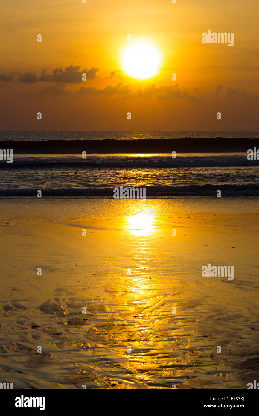Tropical sunset on the beach. Bali island. Indonesia Stock Photo - Alamy