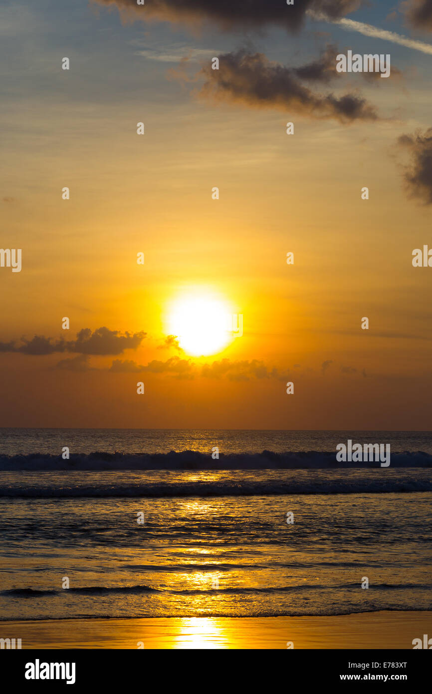 Tropical sunset on the beach. Bali island. Indonesia Stock Photo - Alamy