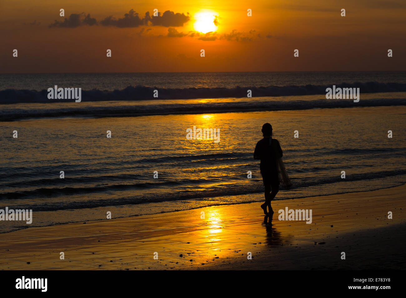 Tropical sunset on the beach. Bali island. Indonesia Stock Photo - Alamy
