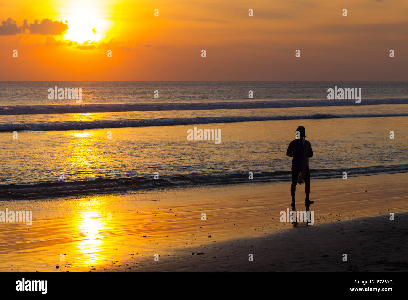 Tropical sunset on the beach. Bali island. Indonesia Stock Photo - Alamy