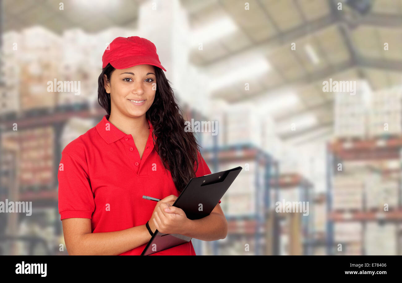 Young worker with red uniform and clipboard at work Stock Photo - Alamy