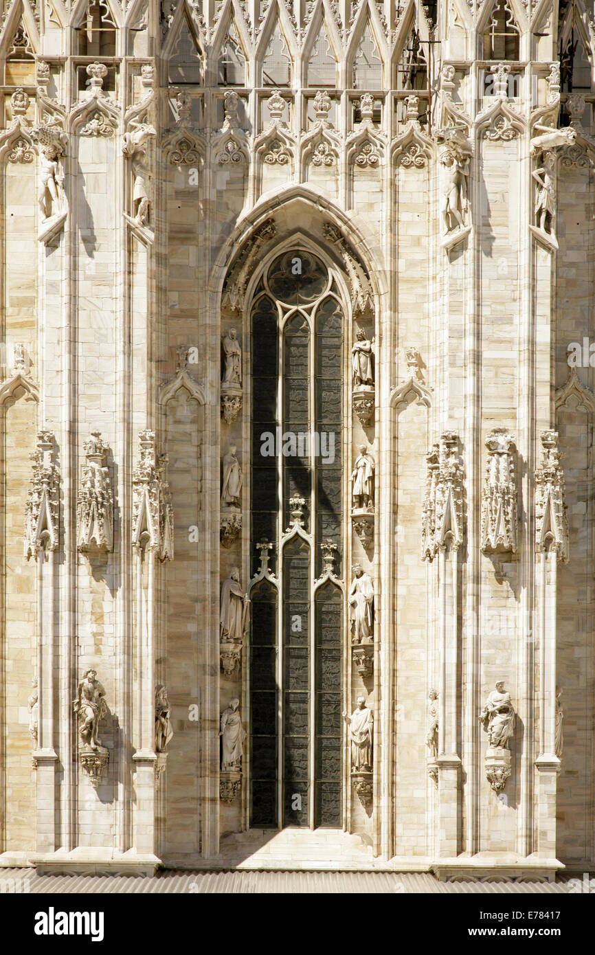 Detail of tall arched stained glass windows in the Duomo or cathedral ...