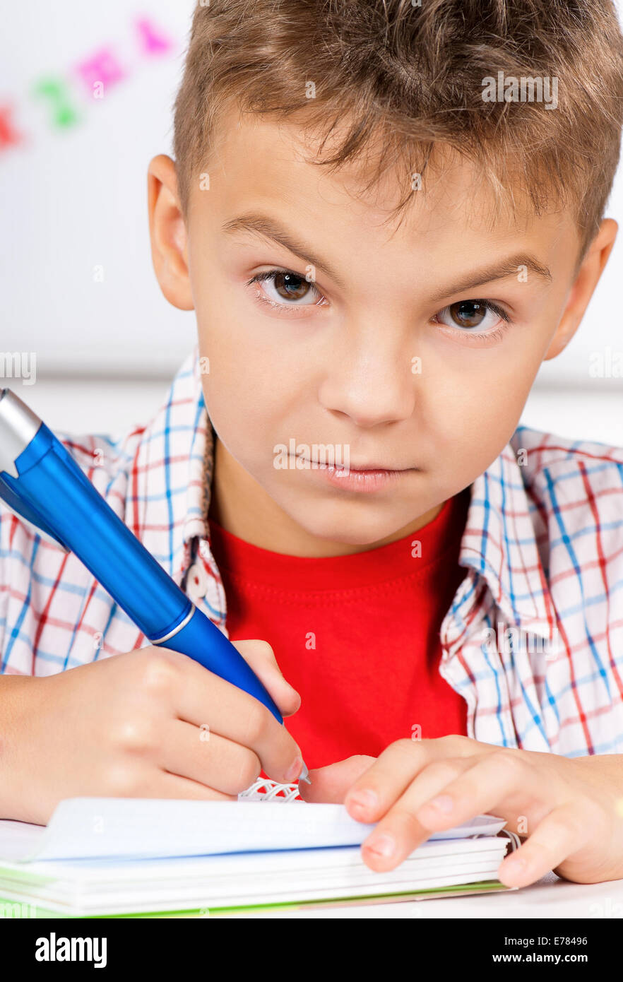 Boy doing homework Stock Photo - Alamy