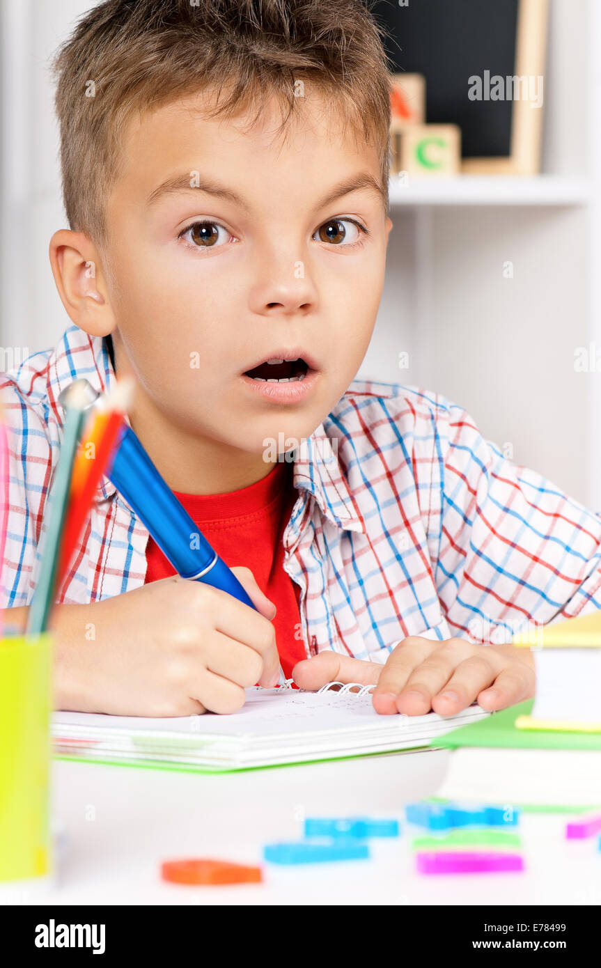 Boy doing homework Stock Photo - Alamy
