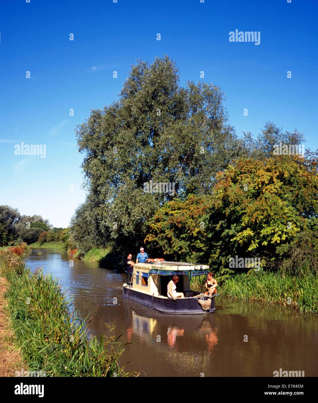 Small narrow boat cruising on the Kennet & Avon canal, Wiltshire ...