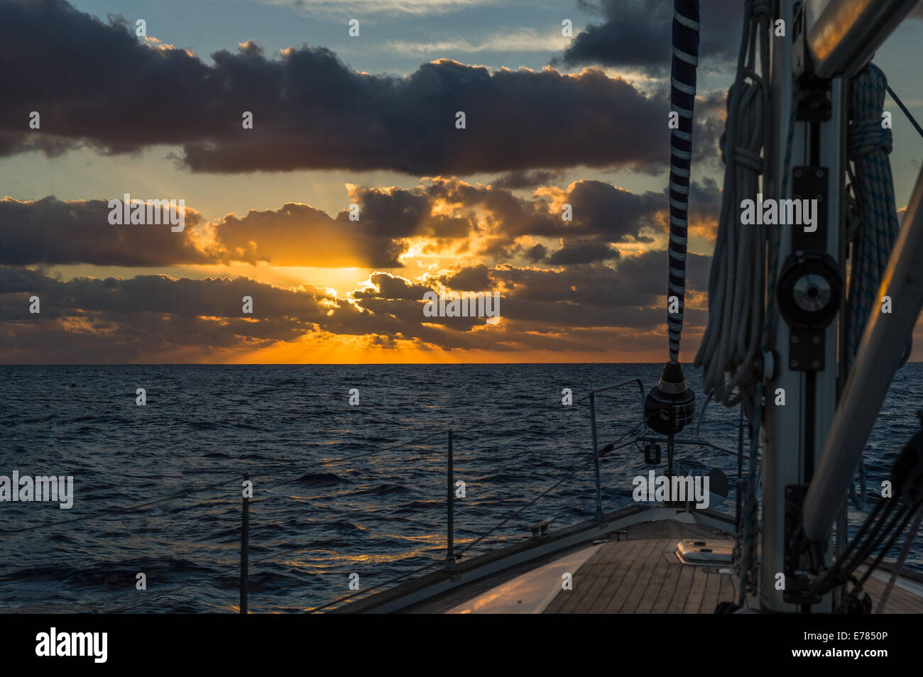 Sailing boat at sunrise in Atlantic ocean Stock Photo - Alamy