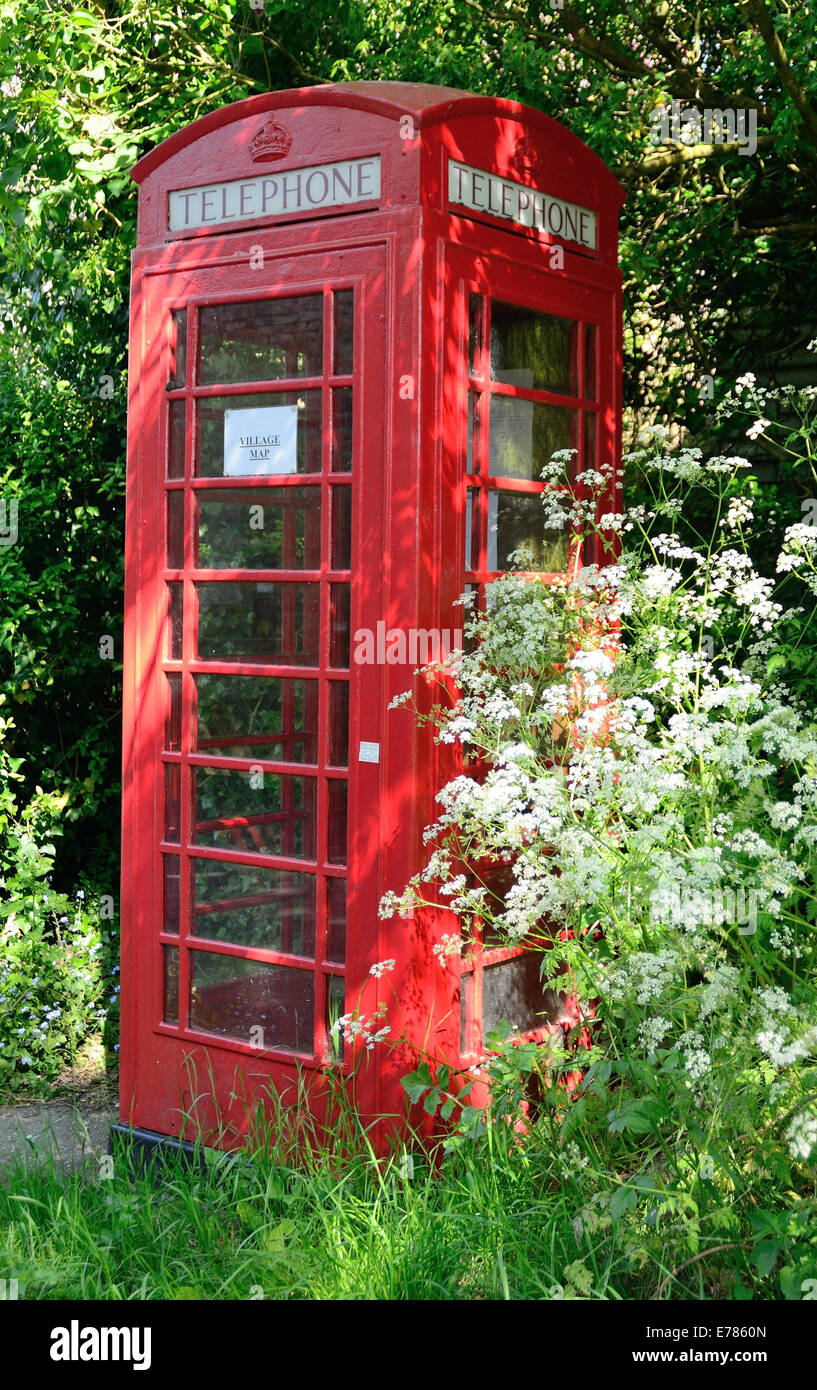 Redundant red telephone box in village location, now used to display ...