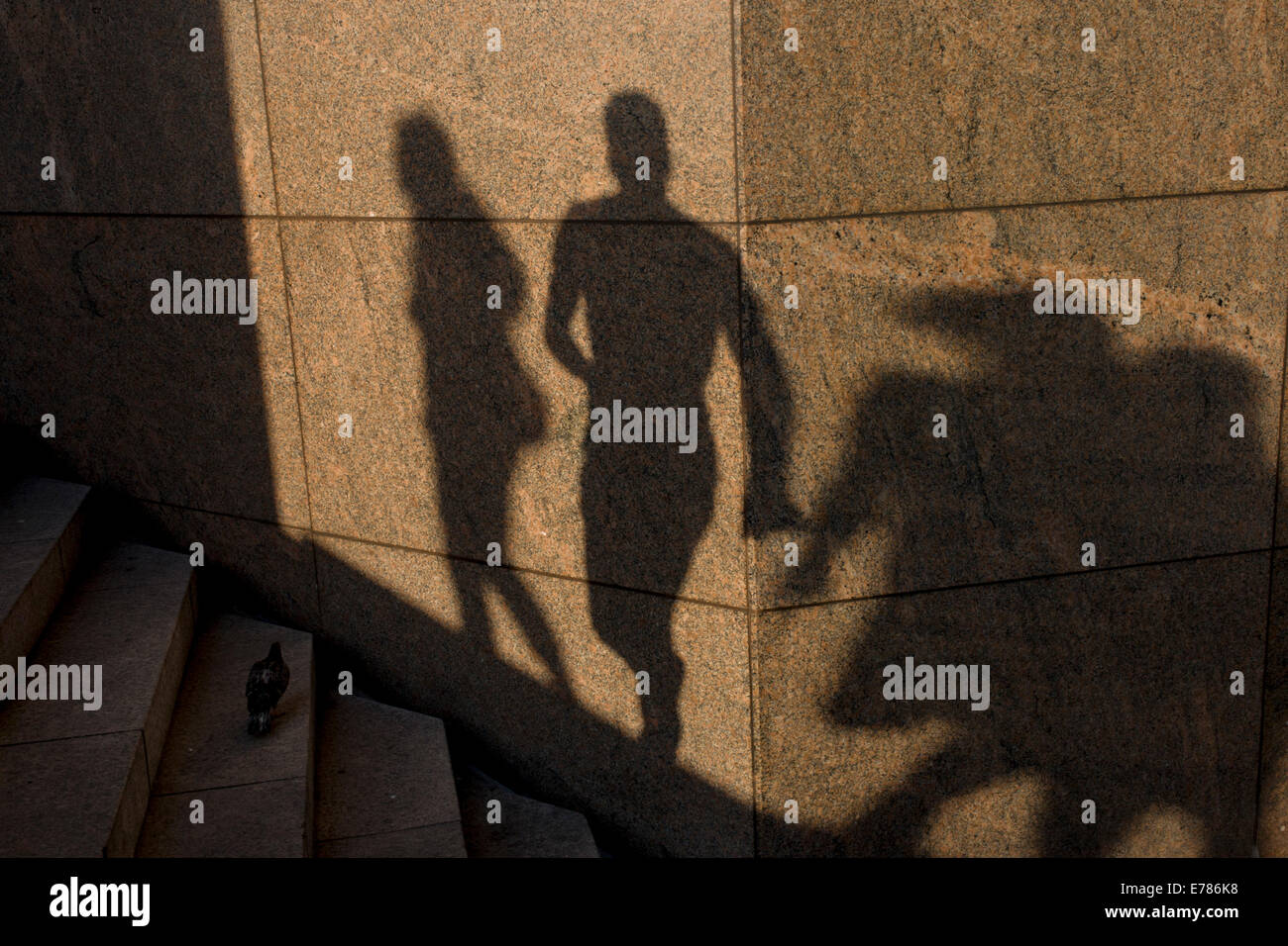 Shadows of people walking up steps on London Bridge, on the southern ...